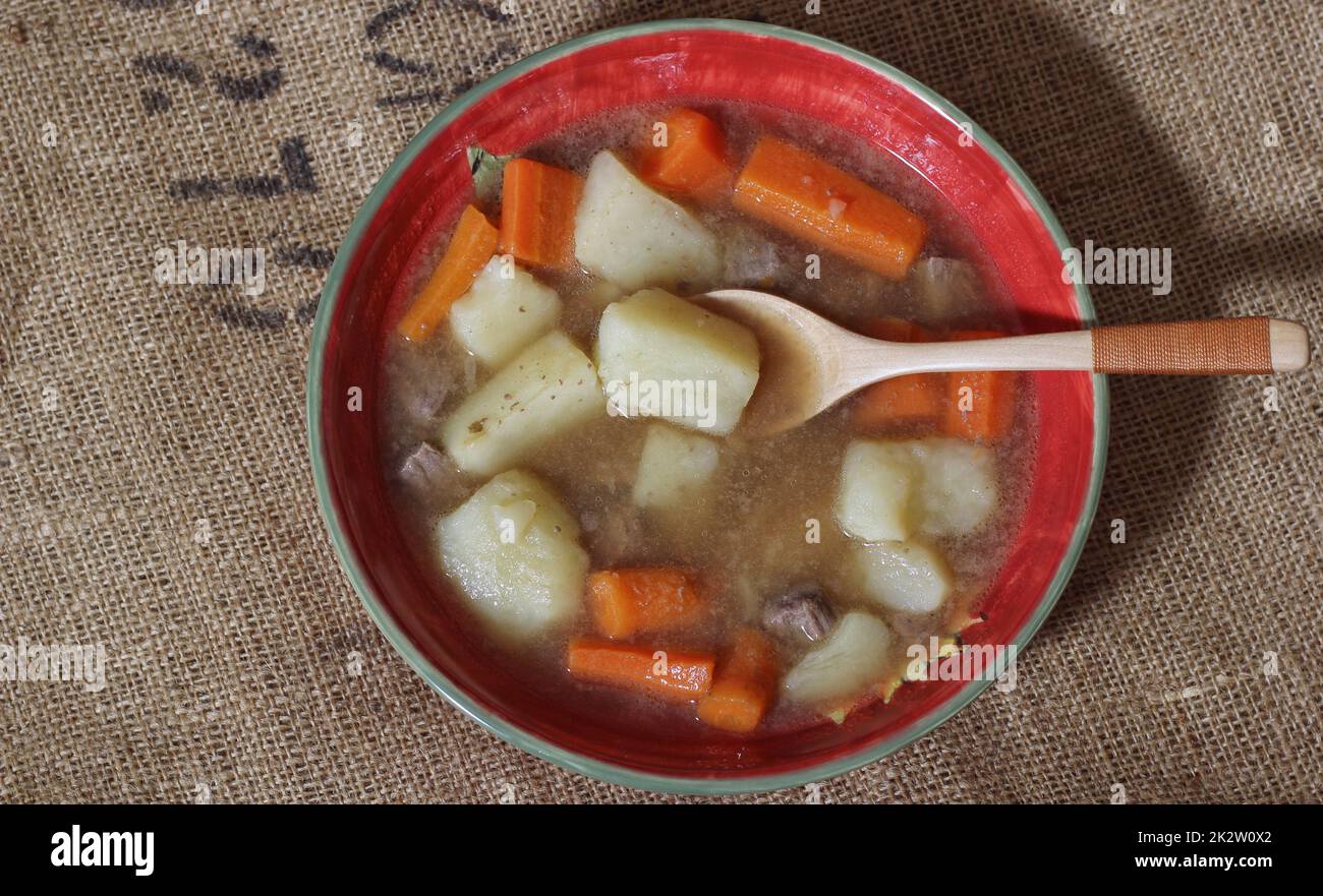 Hearty Beef Stew With Potato and and Carrots on Vintage Burlap potato ...