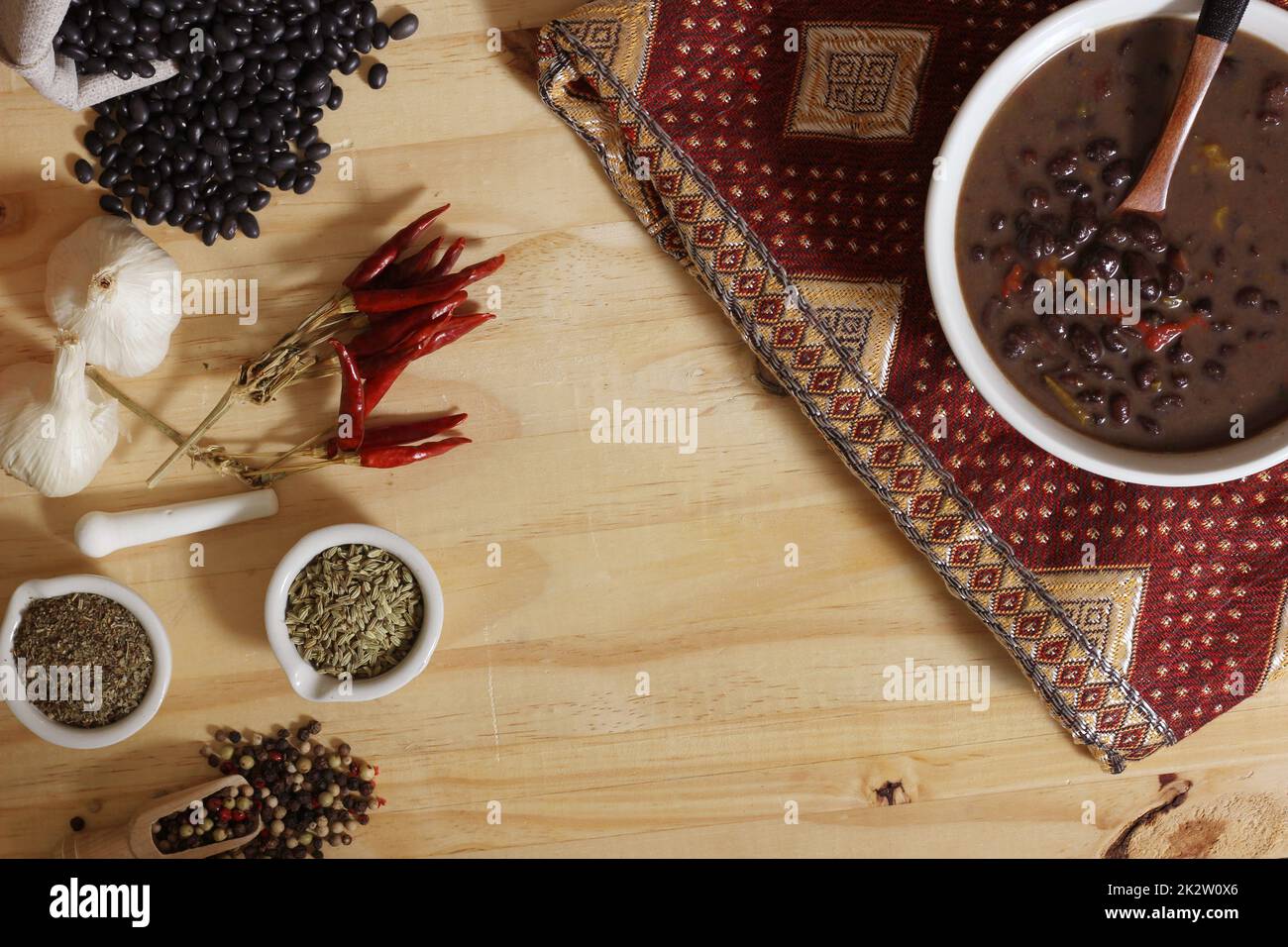 Black Bean Chili on Wooden Table With Spices and Dried Black Beans ...