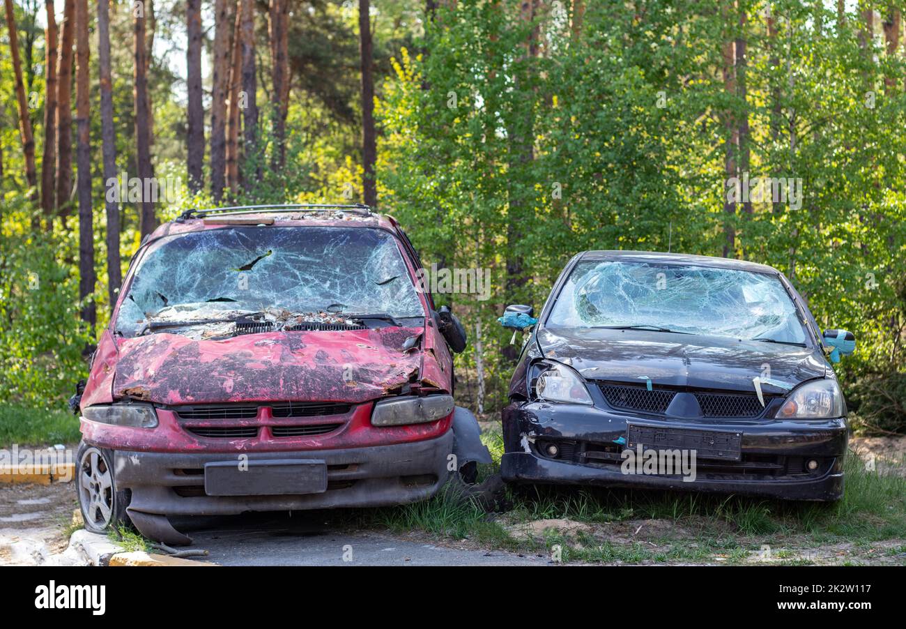 Many broken cars after a traffic accident in the parking lot of a restoration service station on ...