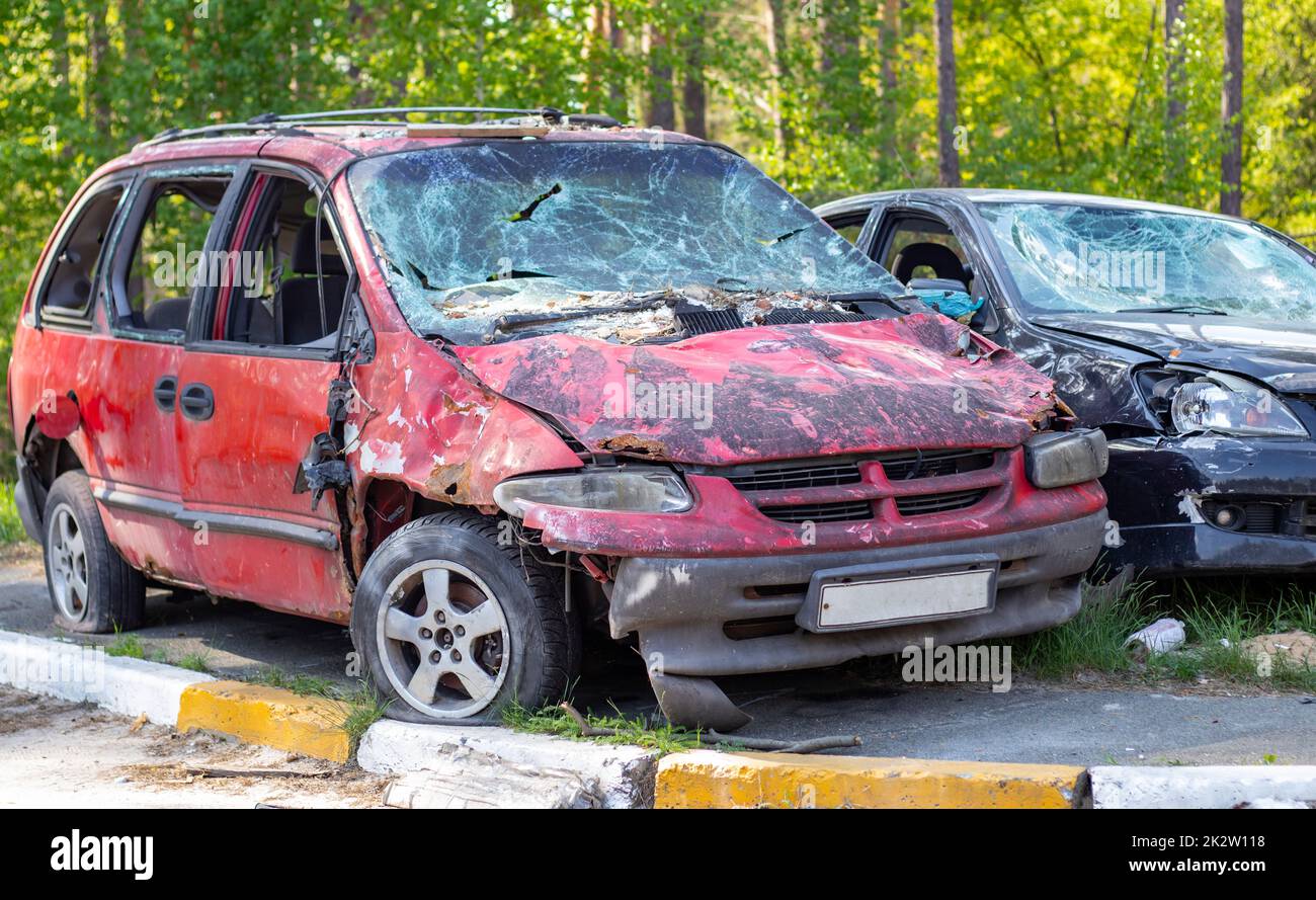 A car destroyed by shrapnel from a rocket that exploded nearby ...