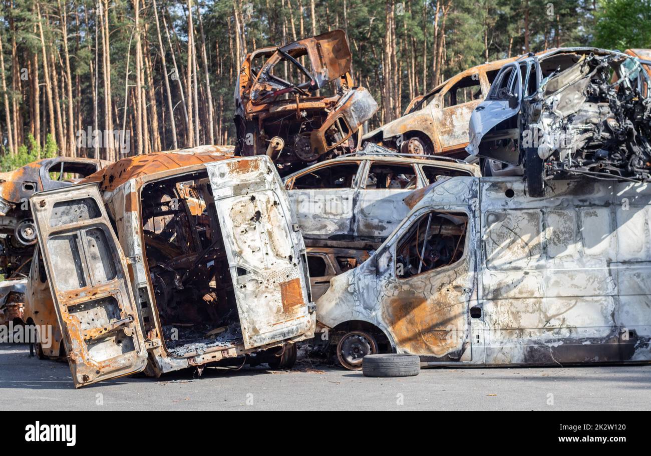 A lot of rusty burnt cars in Irpen, after being shot by the Russian ...