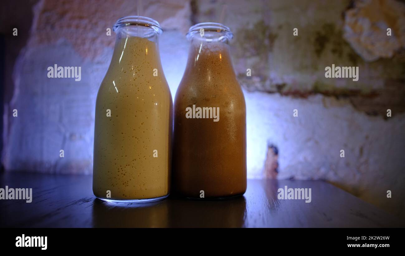 Chocolate milkshake with ice cream vanilla milkshake in glass vintage ...