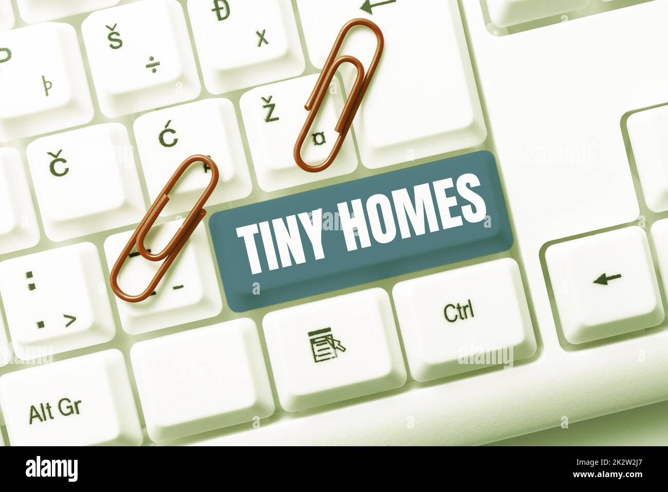 Text sign showing Tiny Homes. Concept meaning houses contain one room ...