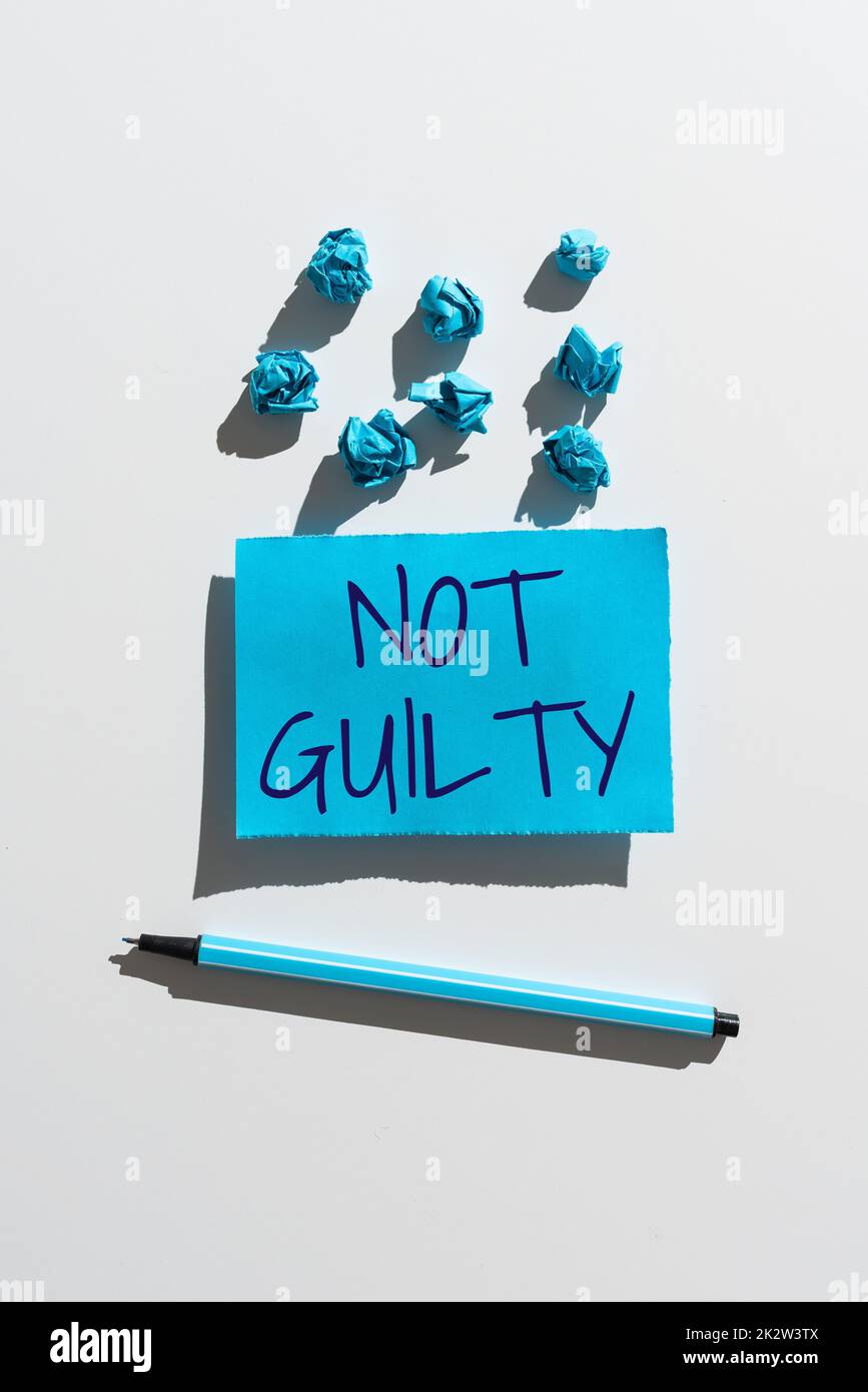 Hand writing sign Not Guilty. Business concept someone is innocent ...