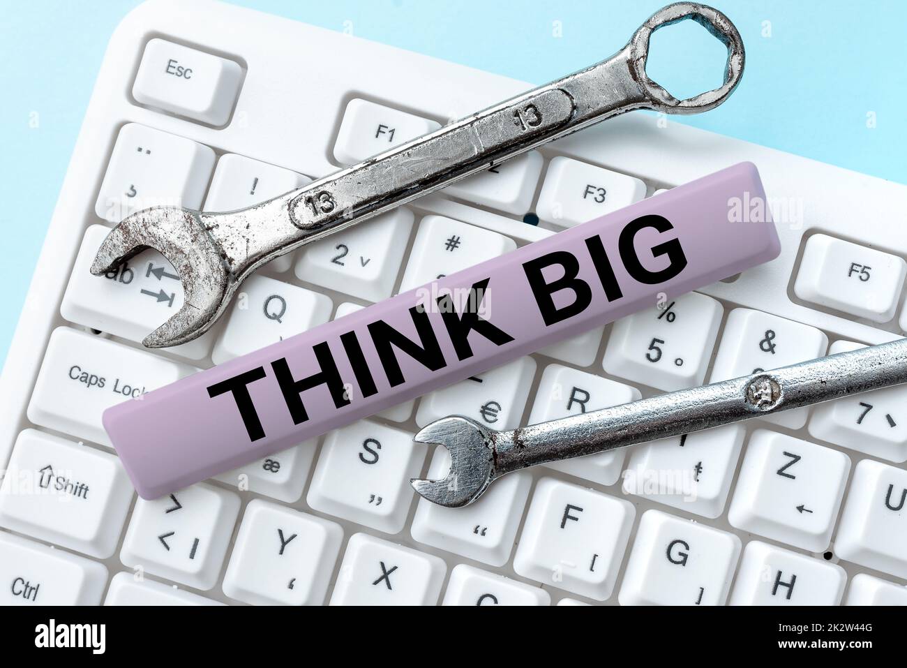 Hand writing sign Think Big. Concept meaning To plan for something high ...