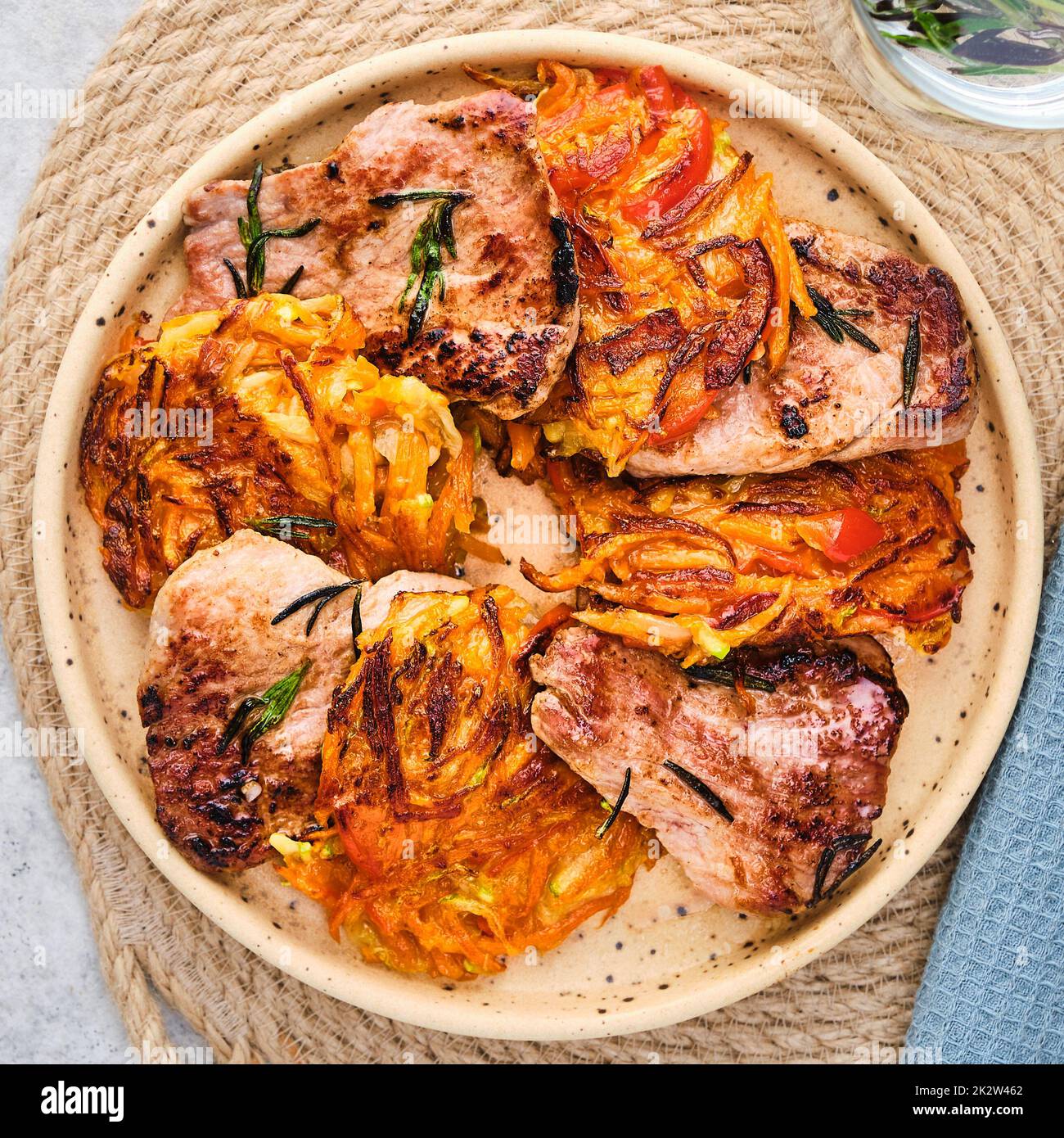 Roasted veal with rosemary and vegetable garnish. Top view Stock Photo ...