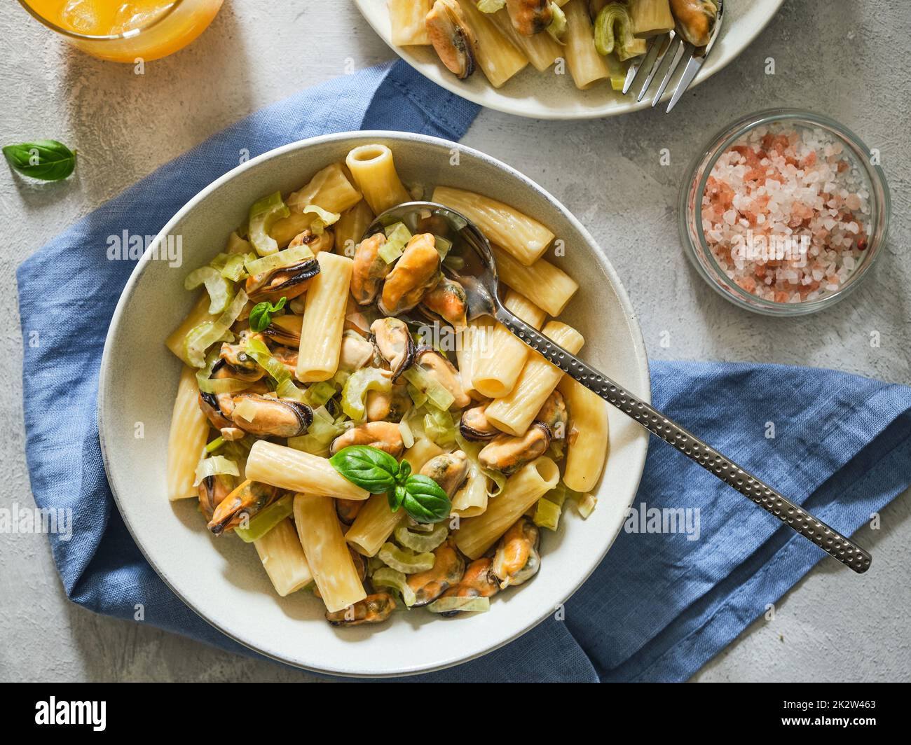 Penne pasta with mussels. Italian food Stock Photo - Alamy