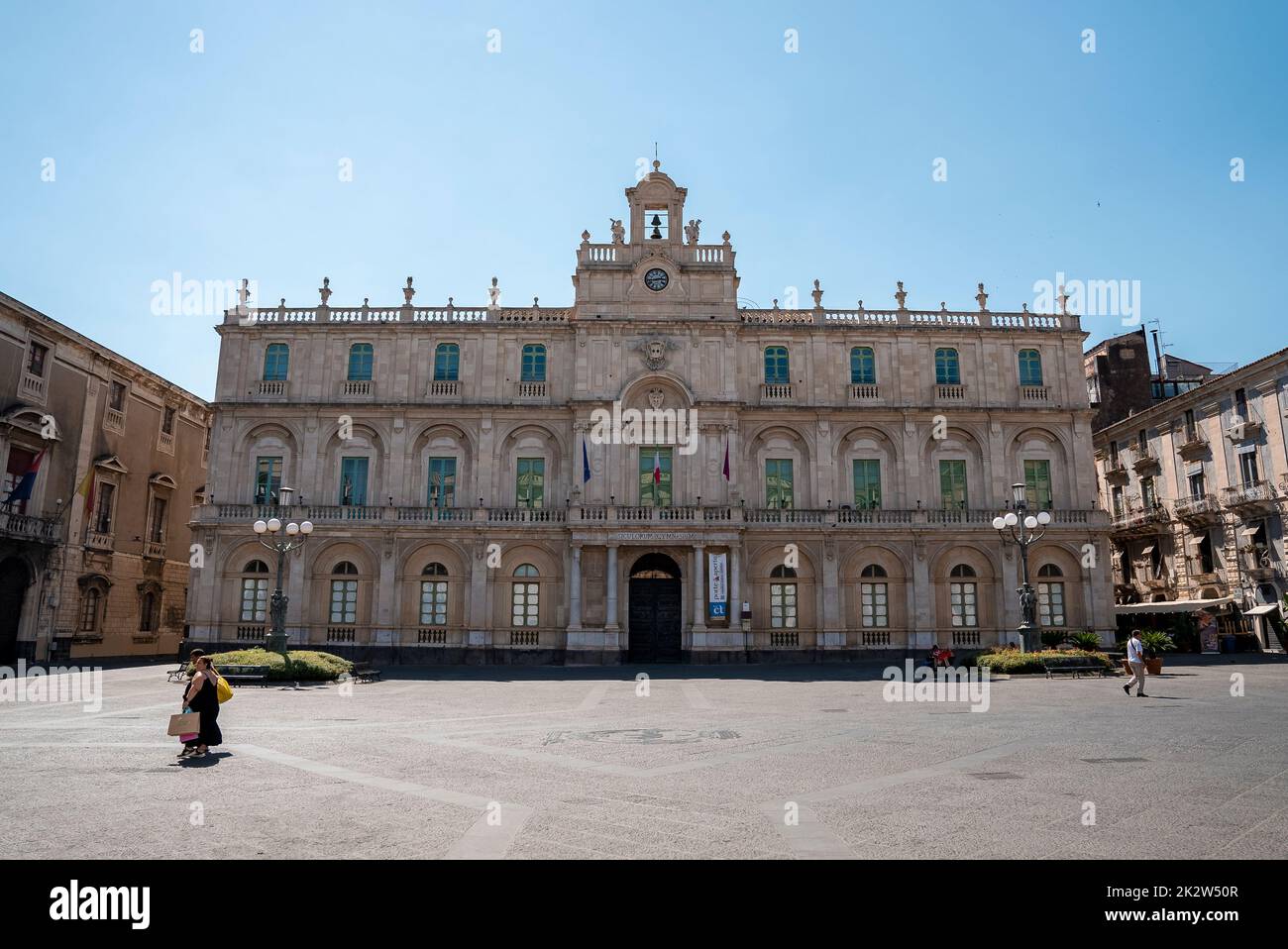 Facade of historic building of university at city square with sky in ...