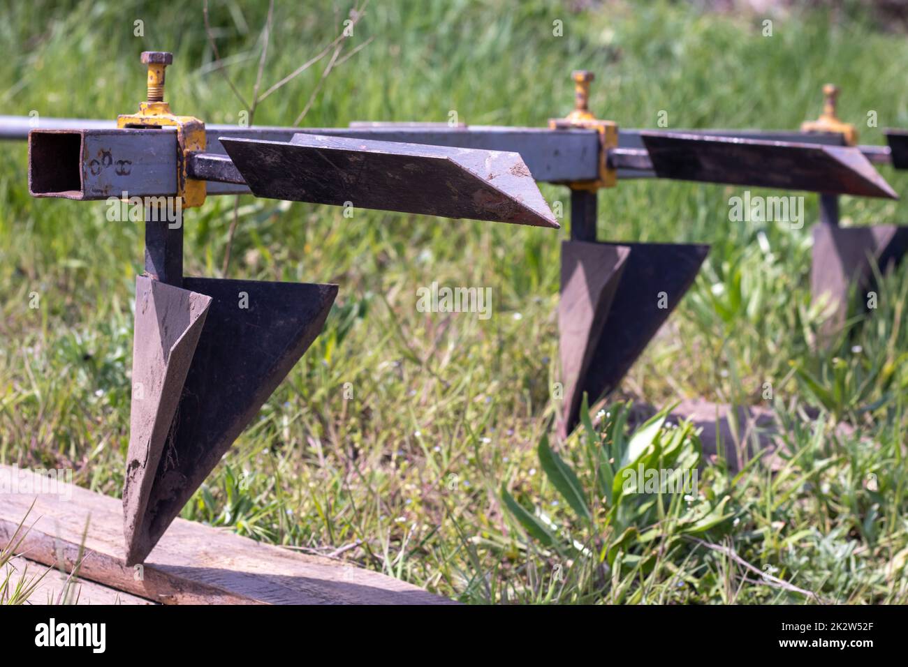 Agricultural manual metal plow on the field. Plowing the land before ...