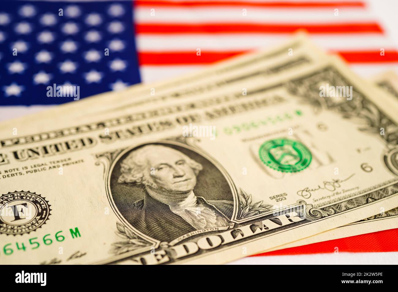 US dollar banknotes money on USA America flag, finance economy concept ...