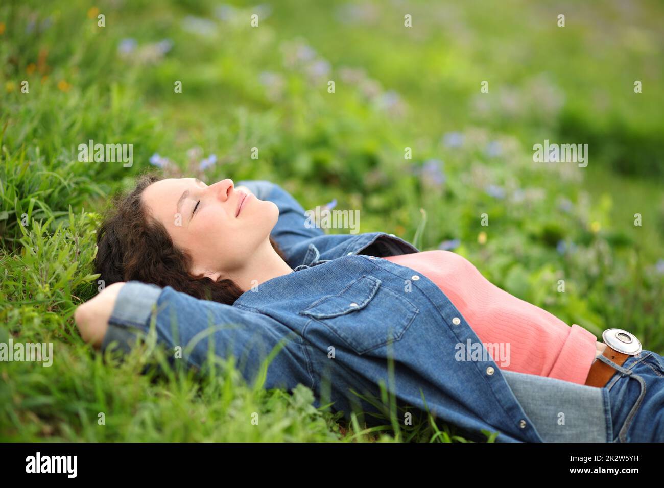 Woman nap grass hi-res stock photography and images - Alamy