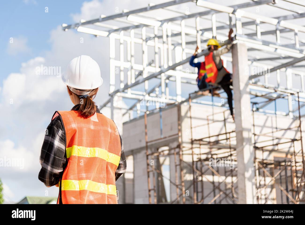 Back one architect standing outdoor at home building construction site ...