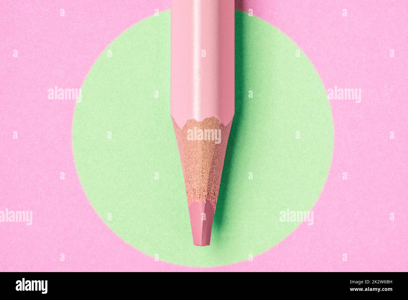 Pink pencil on pink paper with green circle shape graphic Stock Photo ...