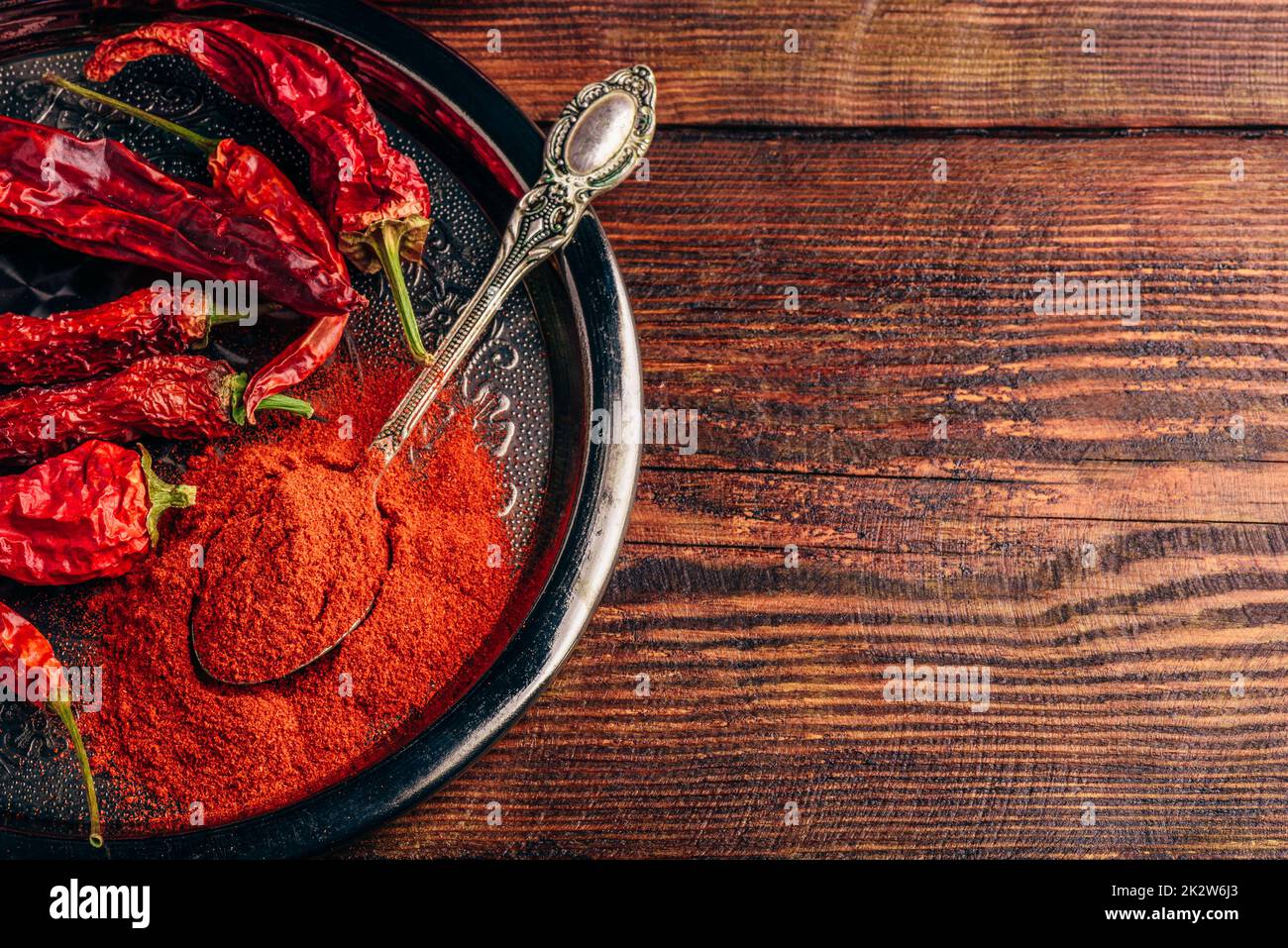 Spoonful of chili pepper powder Stock Photo - Alamy