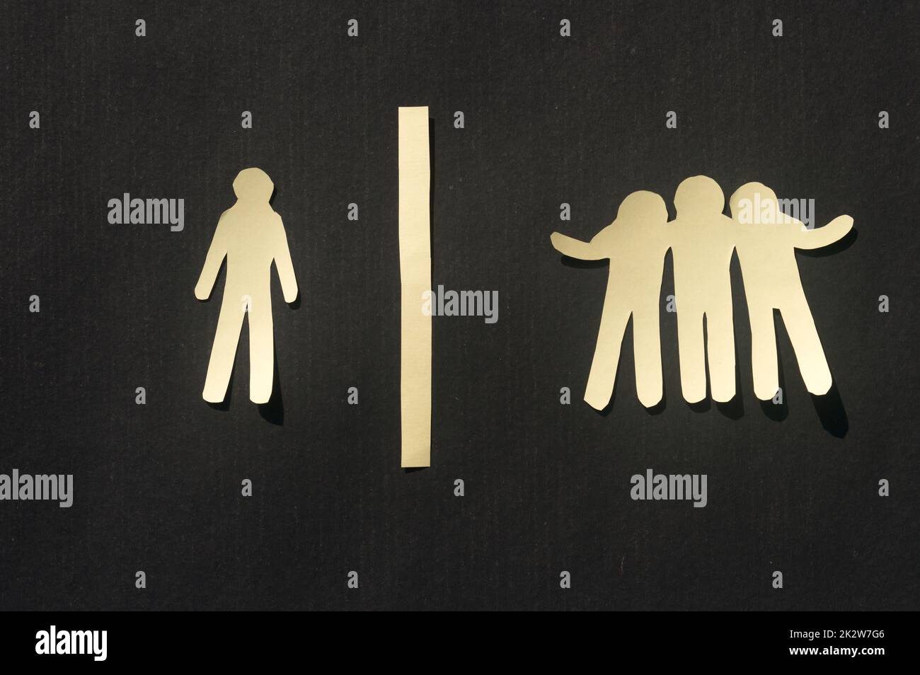 Paper man standing Isolated from group. Feel Left out and alone. Social ...