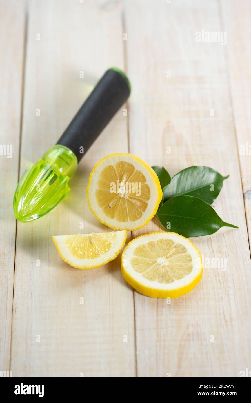 A vertical shot of sliced lemons on the wooden background Stock Photo ...
