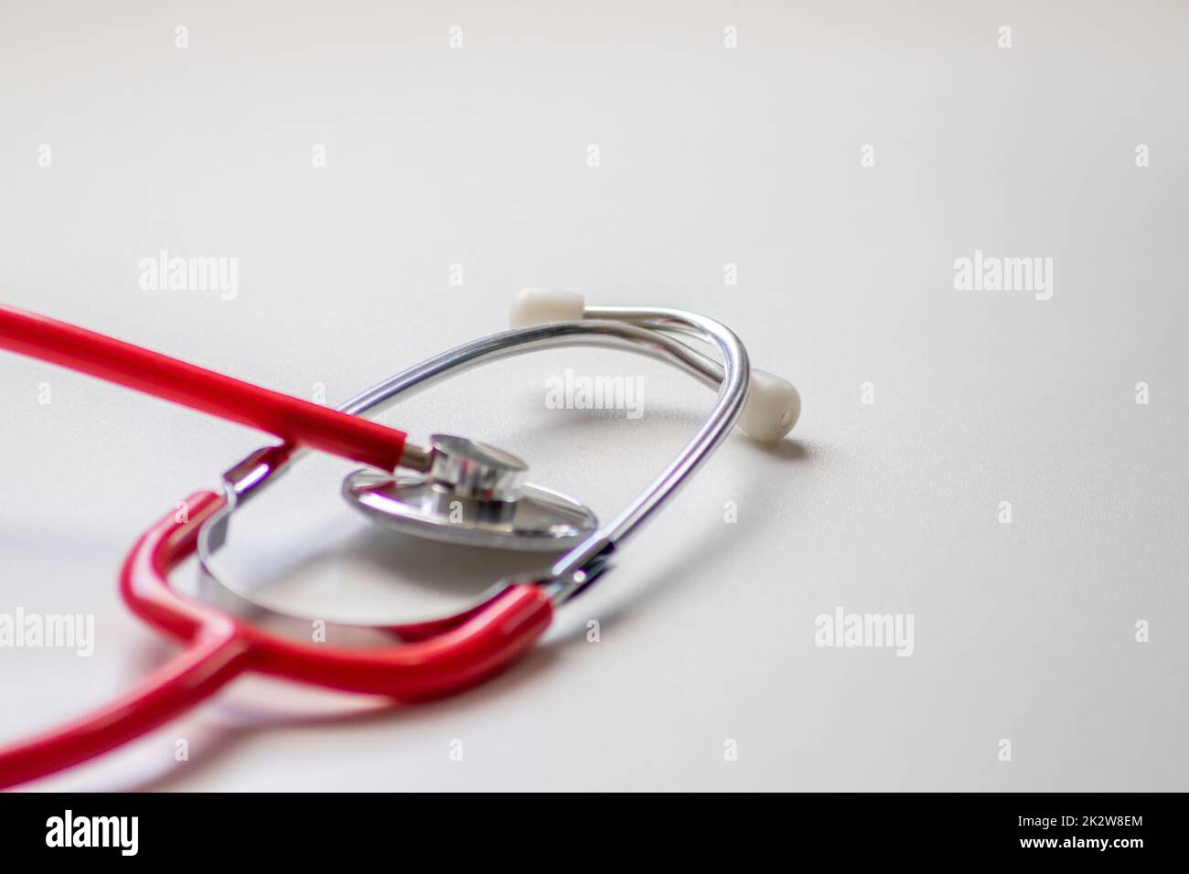 Red stethoscope in doctors office for professional cardio checkup and ...