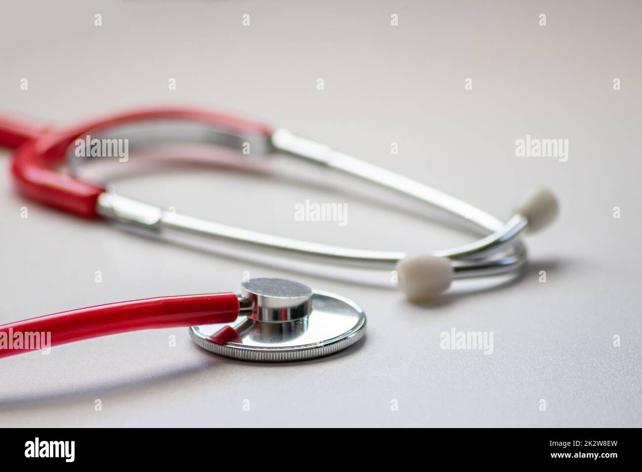 Red stethoscope in doctors office for professional cardio checkup and ...