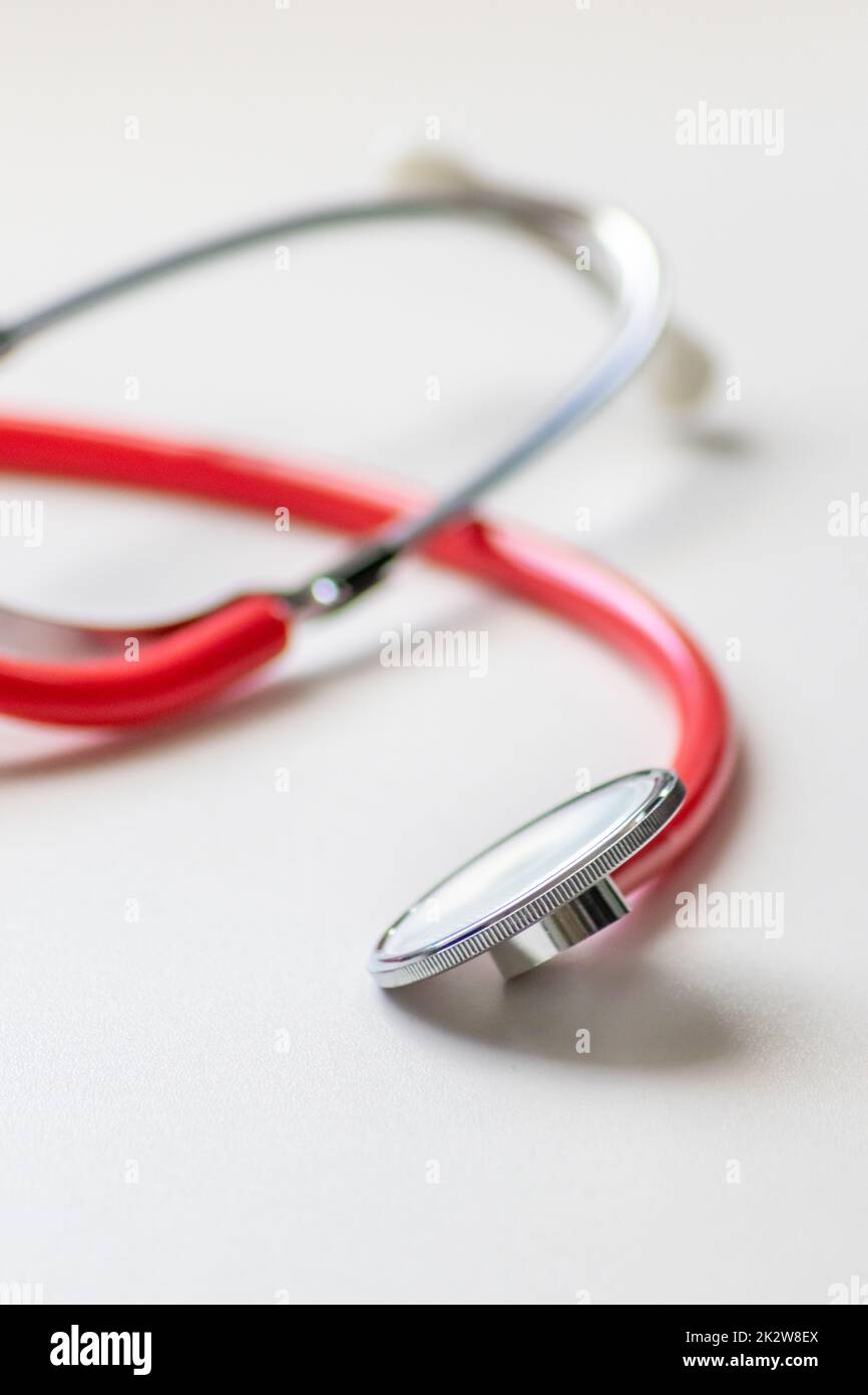 Red stethoscope in doctors office for professional cardio checkup and ...