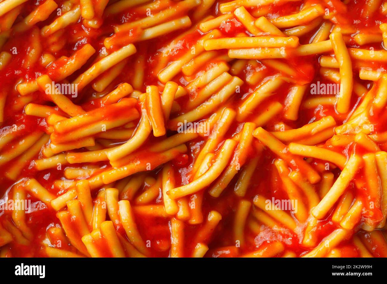 spaghetti noodle in tomato sauce food background Stock Photo - Alamy