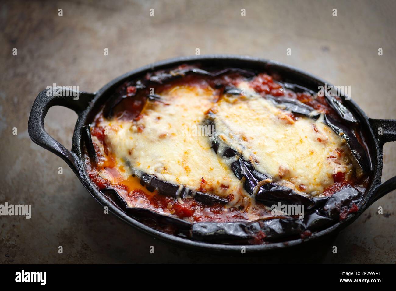 rustic italian comfort food eggplant parmigiana Stock Photo - Alamy