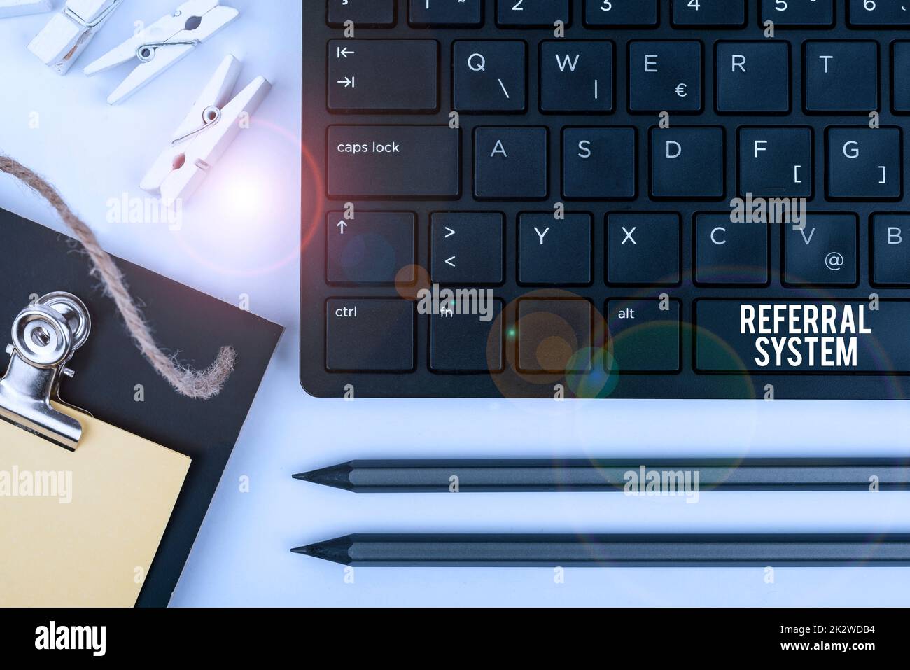Handwriting text Referral System. Conceptual photo sending own patient ...