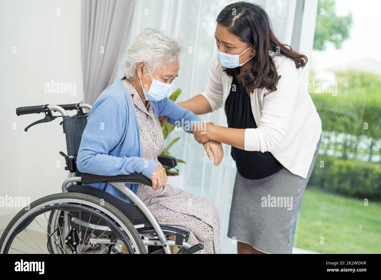 Help Asian senior or elderly old lady woman sitting on wheelchair and ...