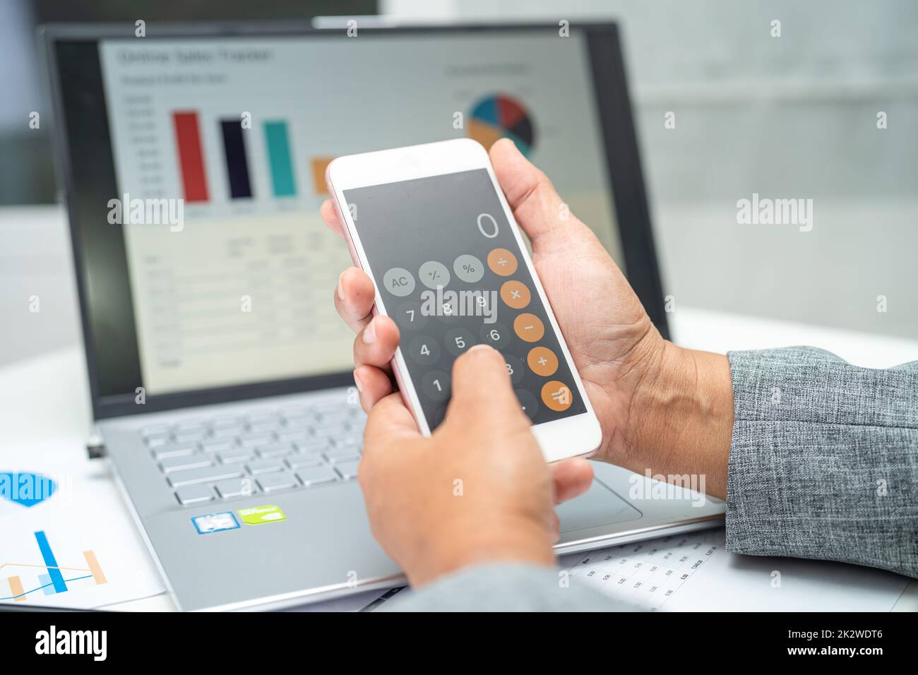 Asian accountant working and analyzing financial reports project ...