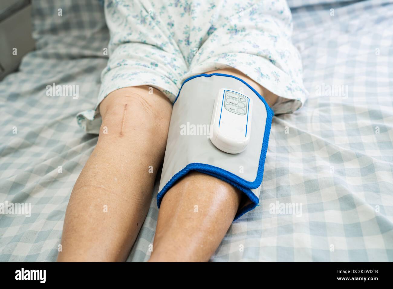 Asian senior or elderly old woman patient with Cordless Air Compression Pressure Leg Massage on ...