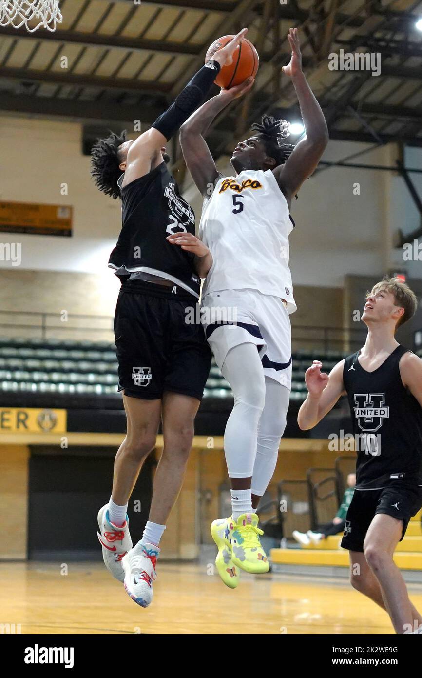 A vertical of African Americans playing basketball at Bosco vs United ...
