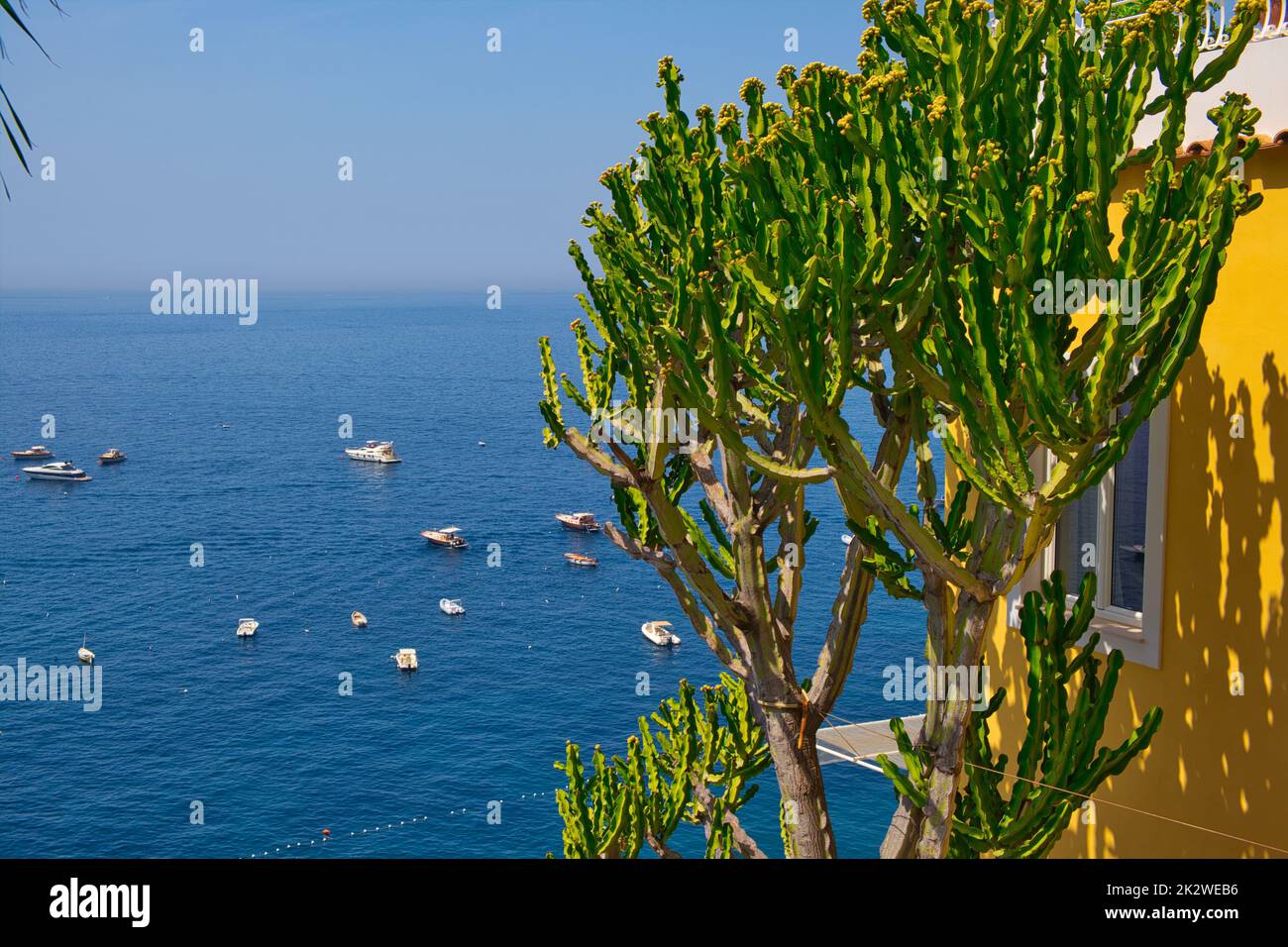 An aerial view of boats on the blue sunny sea of Positano, Italy Stock ...