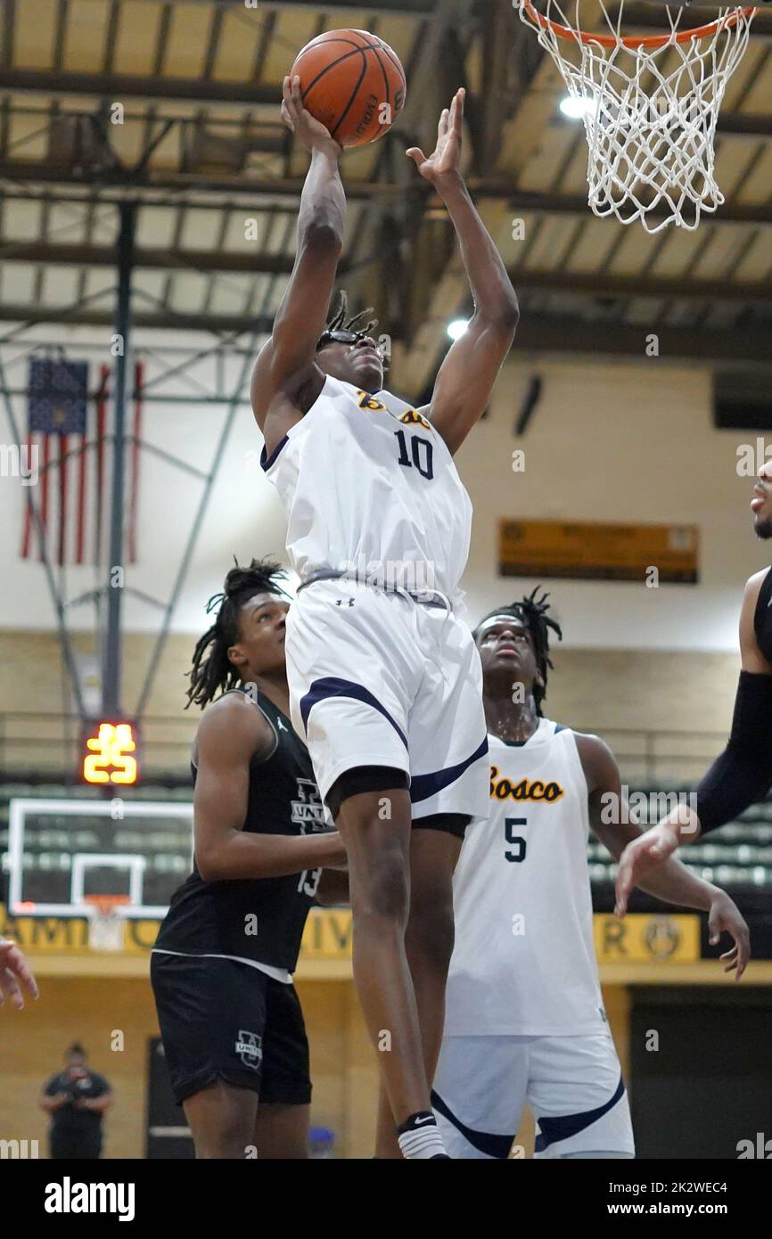 A vertical of African Americans playing basketball at Bosco vs United ...