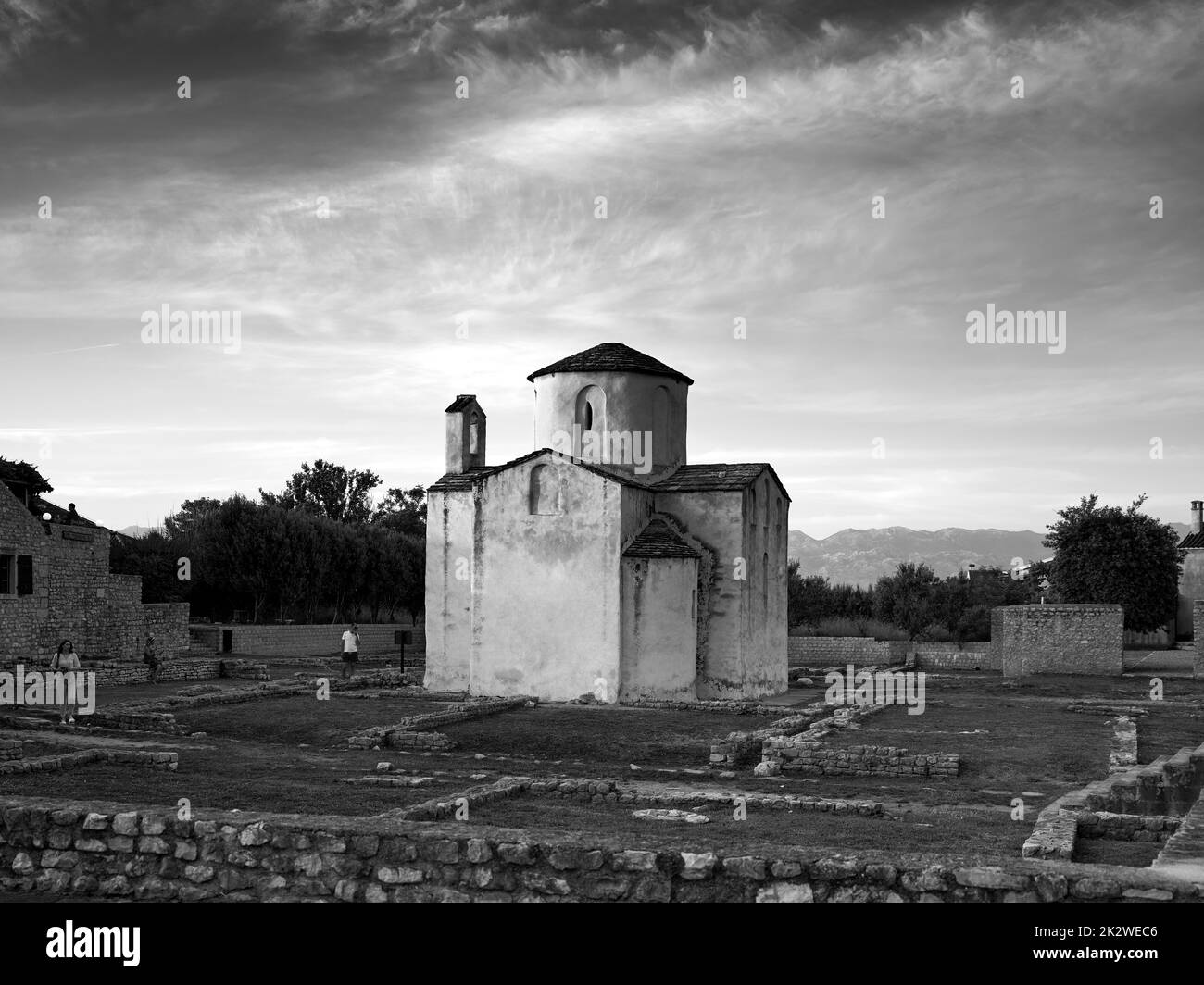 A low-angle view of a small church in old town Nin, Croatia Stock Photo ...