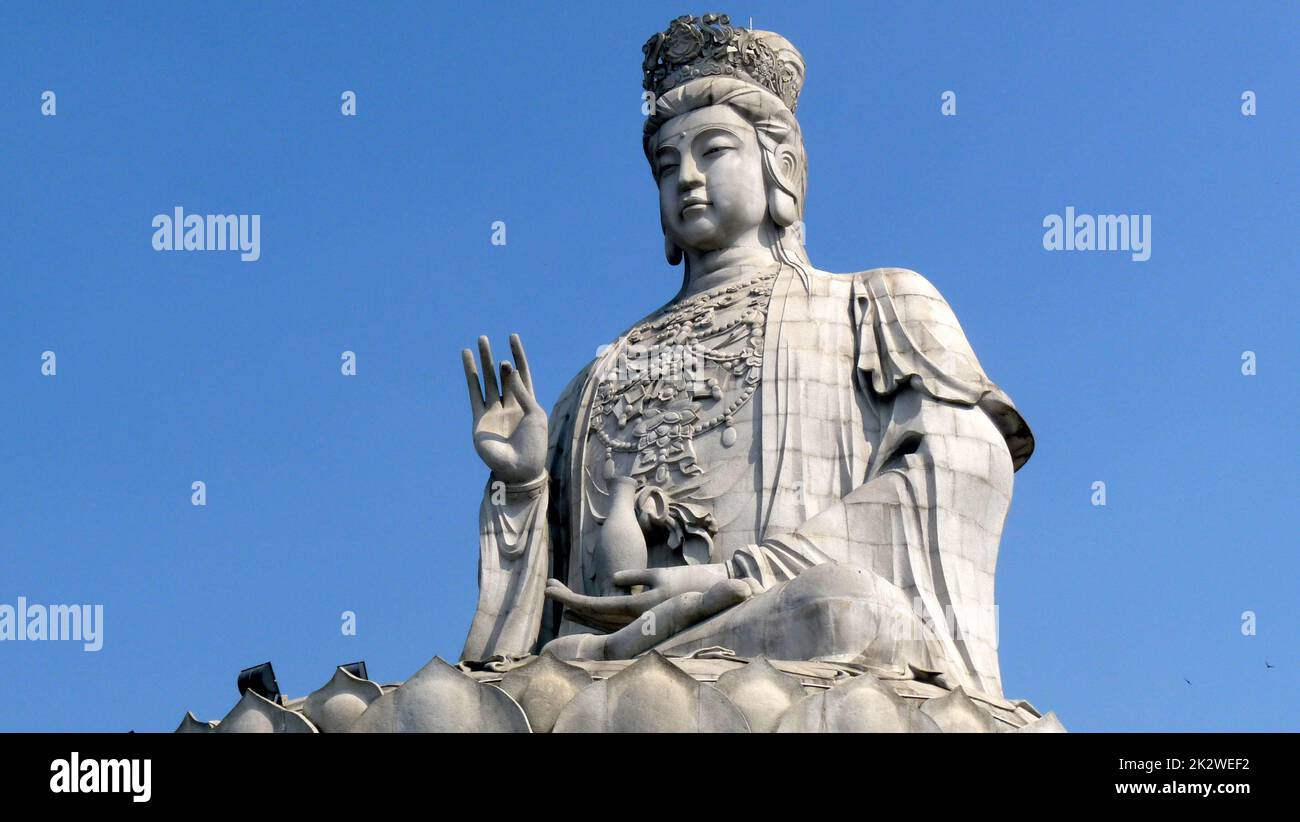 A giant statue with a blue sky background Stock Photo - Alamy