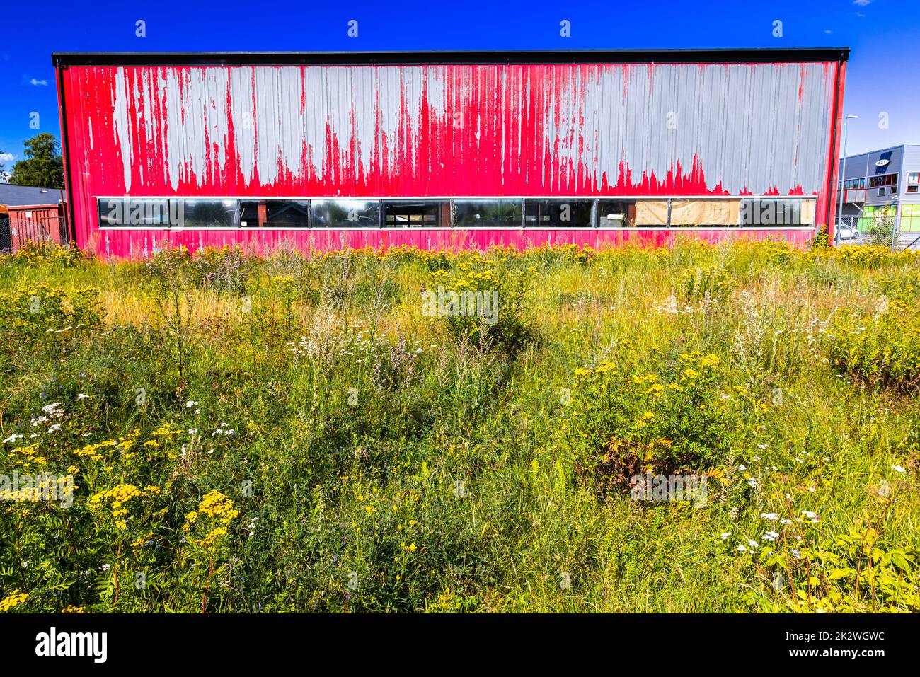 An old red abandoned wooden shed on a rural field Stock Photo - Alamy