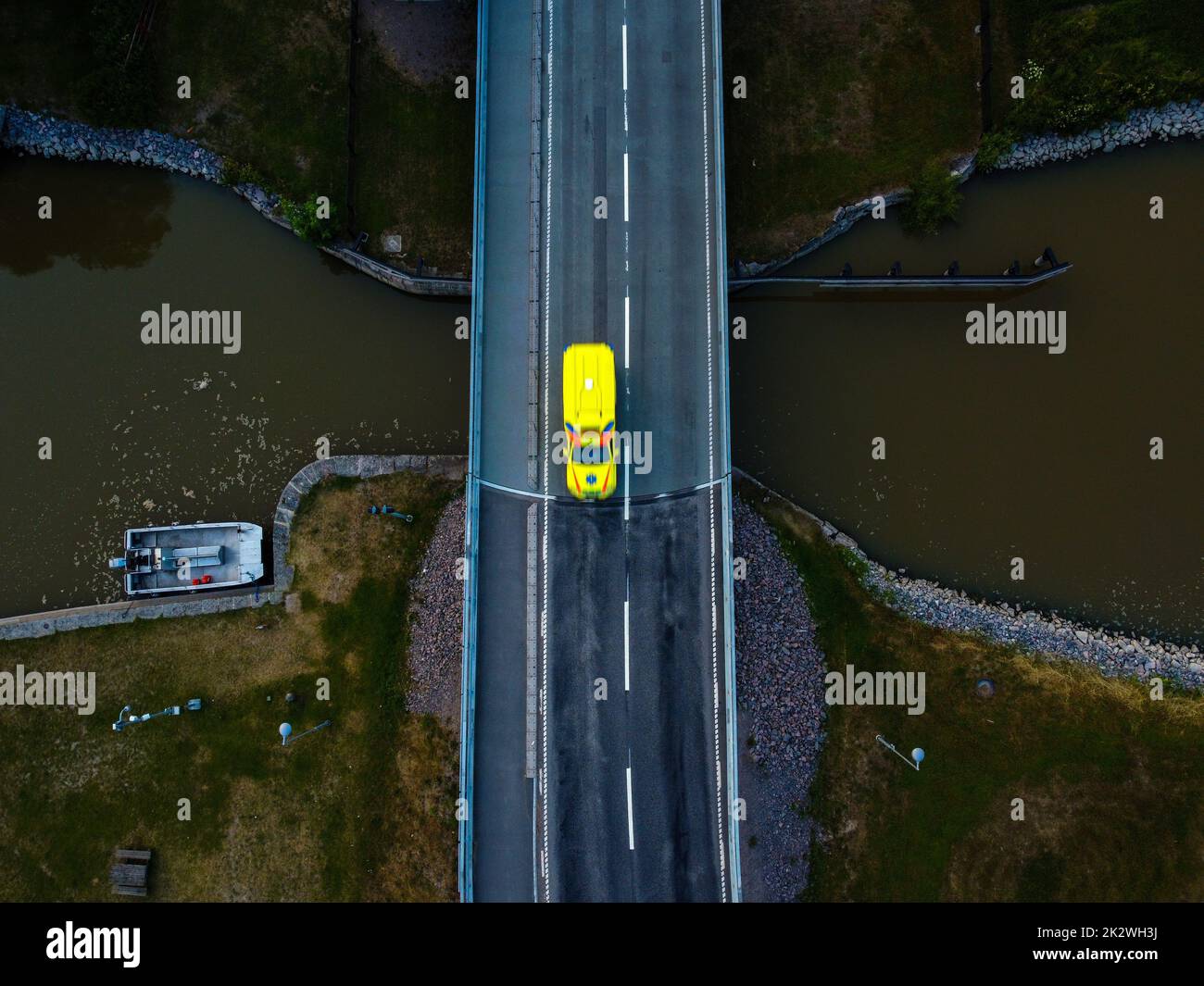 An aerial view of yellow bus on the country road Stock Photo - Alamy