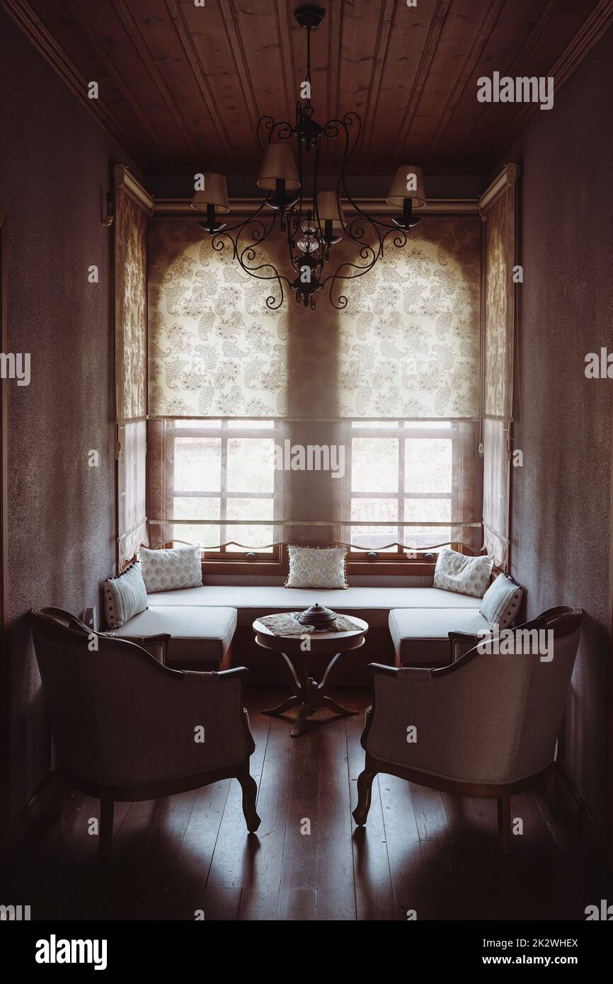 front view of divan with several pillows in front of window Stock Photo ...