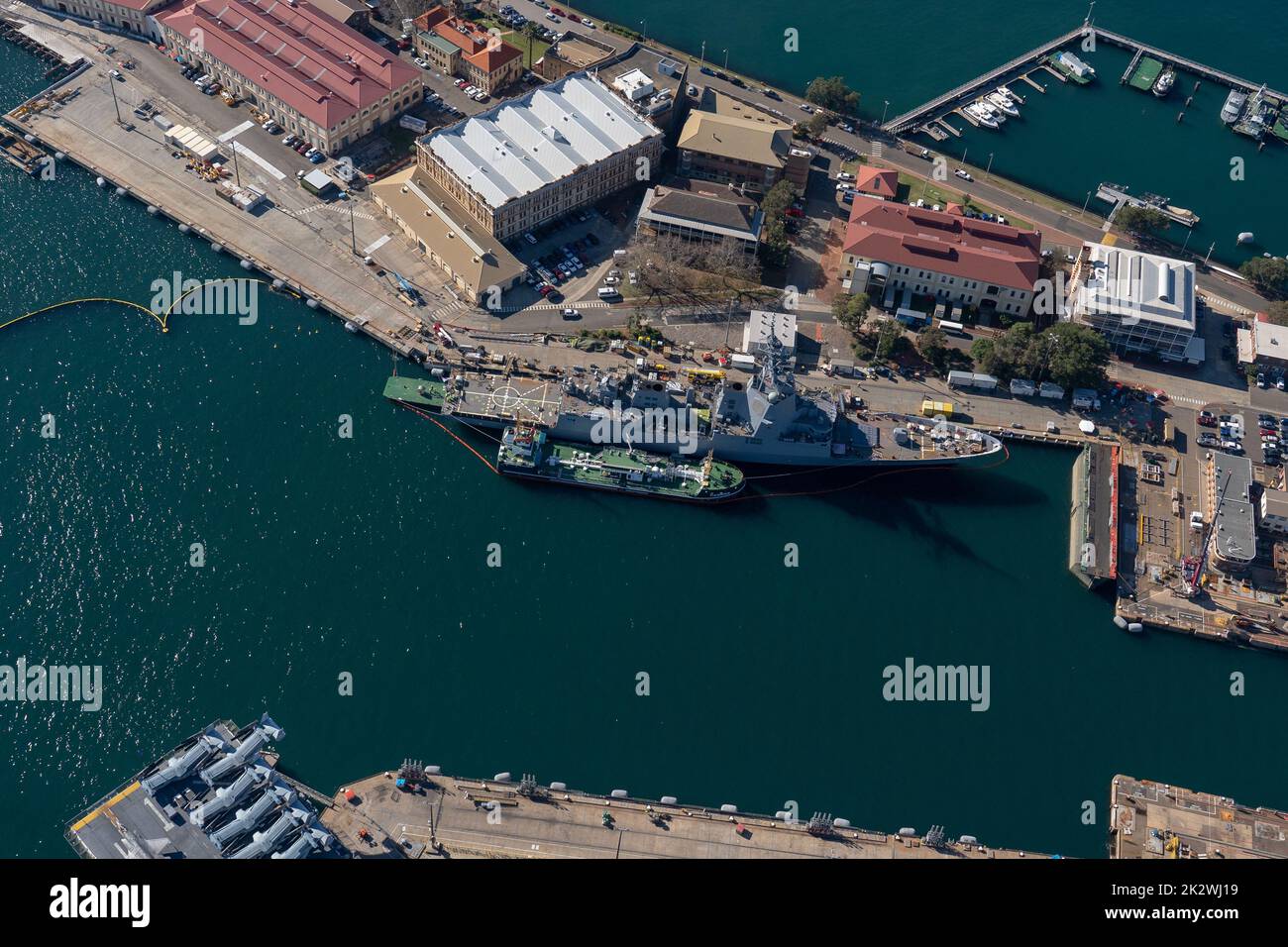 A high angle shot of naval base ship and the Royal Navy ship in dock ...