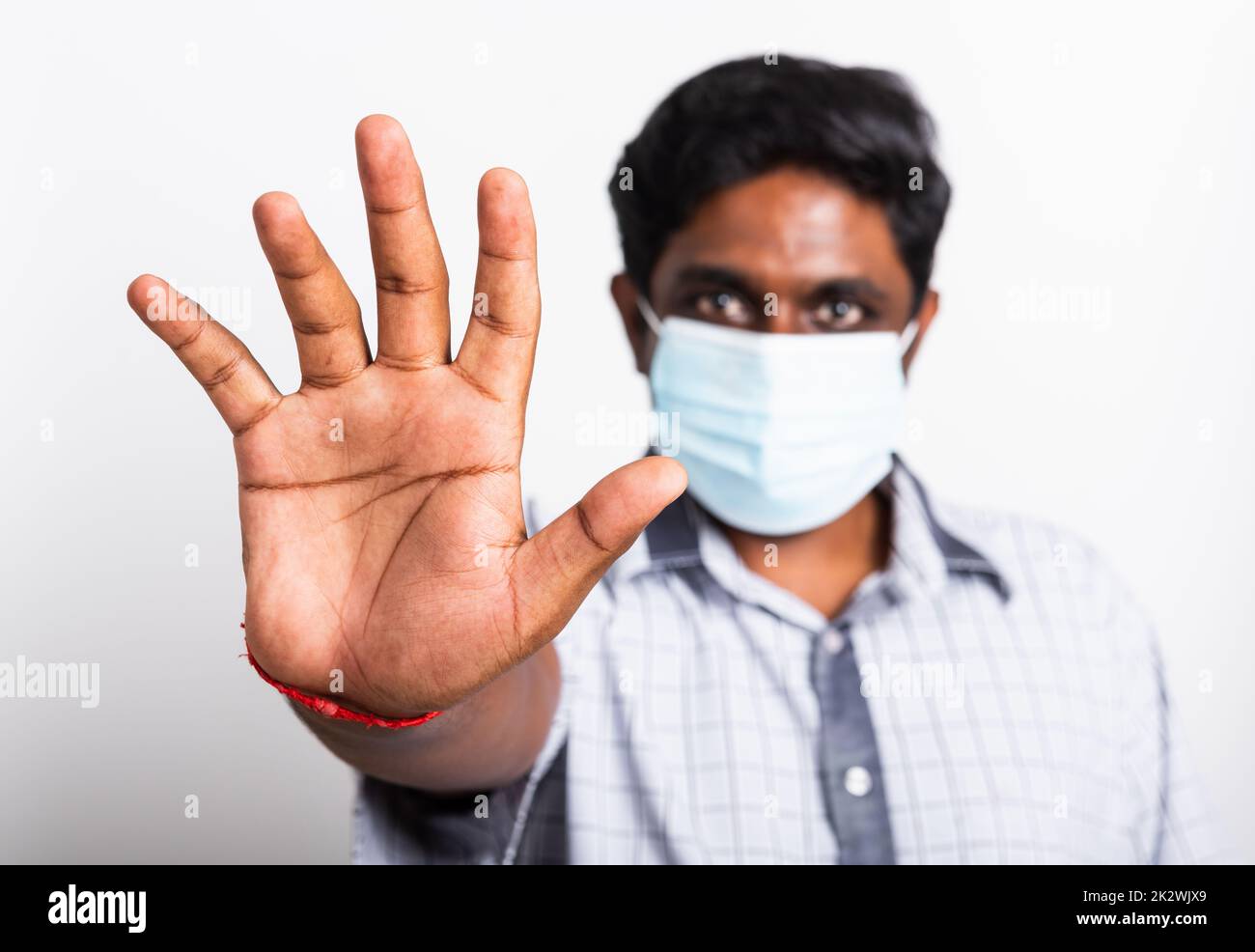black man wearing surgical hygienic protective cloth face mask against ...