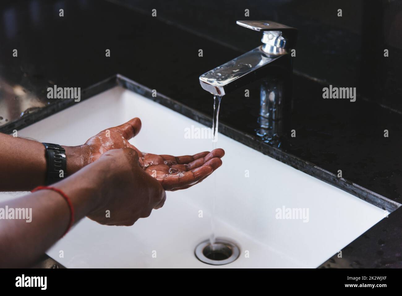 man hands rubbing with soap and water in sinks Stock Photo - Alamy