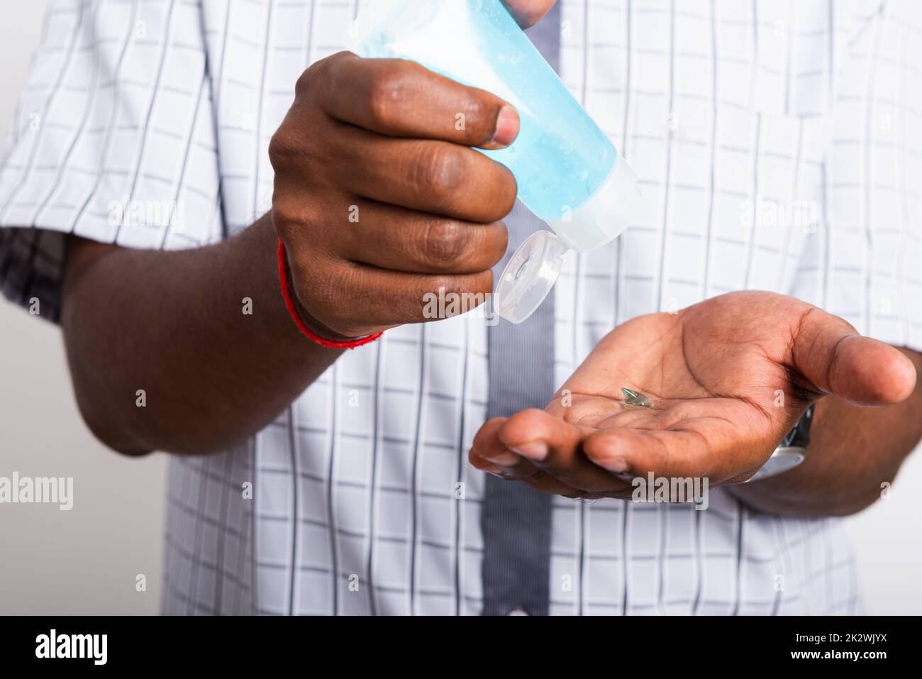 black man wearing protective face mask use sanitizer gel face clean his ...