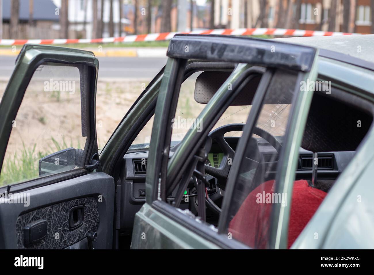 Criminal incident. Breaking into a car parked on the street. Broken ...