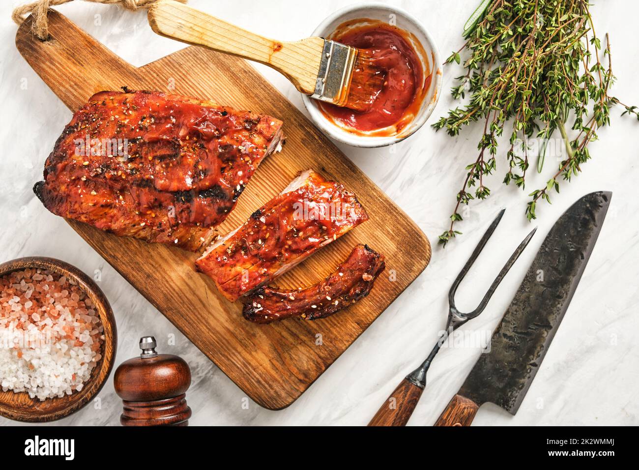 Delicious barbecued ribs seasoned with a spicy basting sauce and served ...