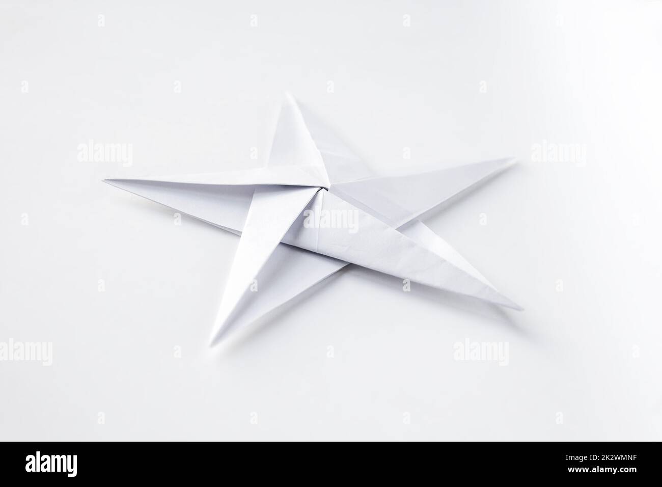 Paper star origami isolated on a white background Stock Photo - Alamy