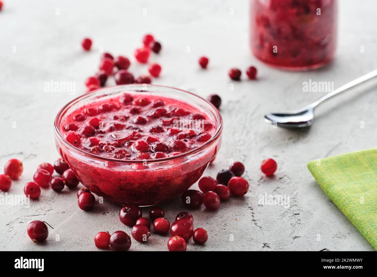 Cranberry jam in a glass bowl on a gray background Stock Photo - Alamy