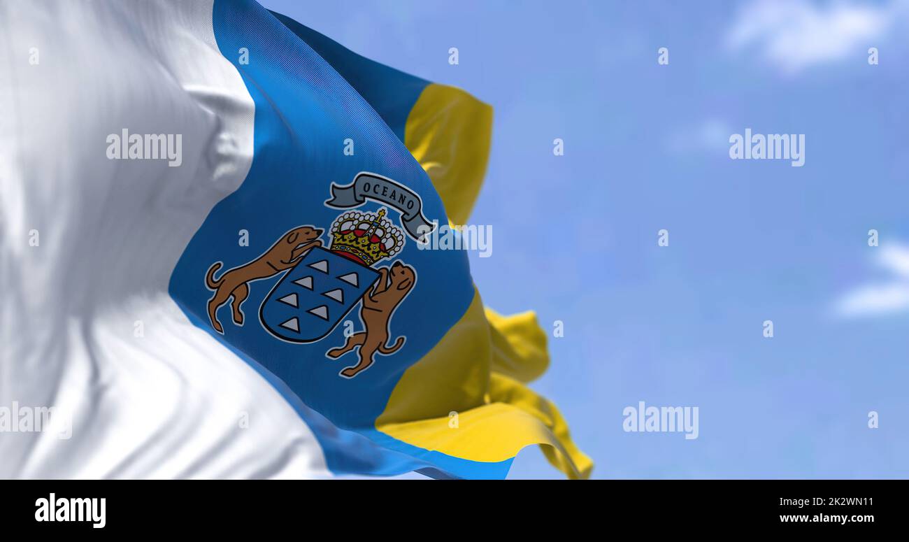 The Canary Islands flag waving in the wind on a clear day Stock Photo ...