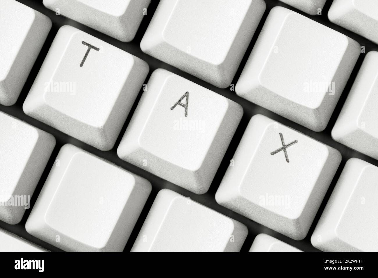 Tax word on computer keyboard keys Stock Photo - Alamy