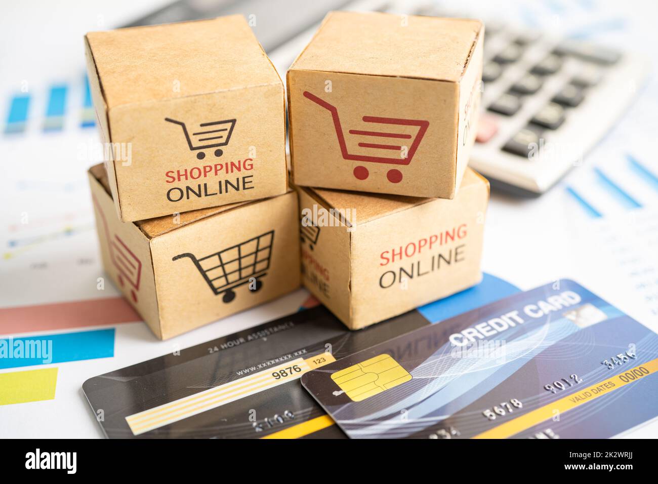 Shopping online box with credit card and calculator on graph. Finance ...