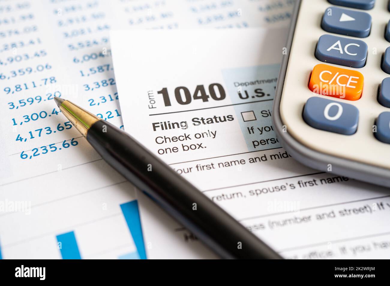 Tax Return form 1040 with USA America flag and dollar banknote, U.S ...
