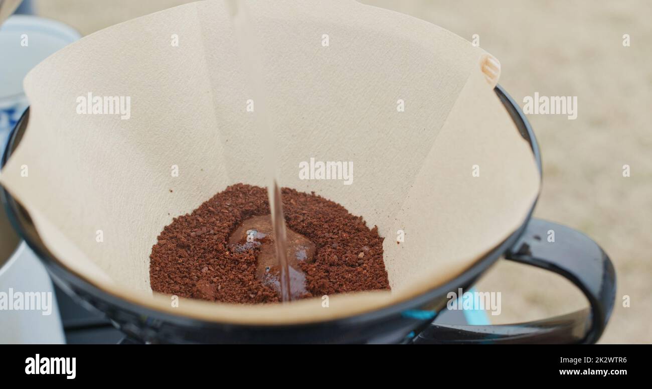 Homemade freshly brewed paper hand drip coffee Stock Photo - Alamy